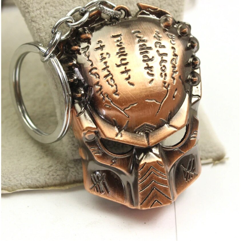 Breloc Masca de Predator aramiu - eMAG.ro